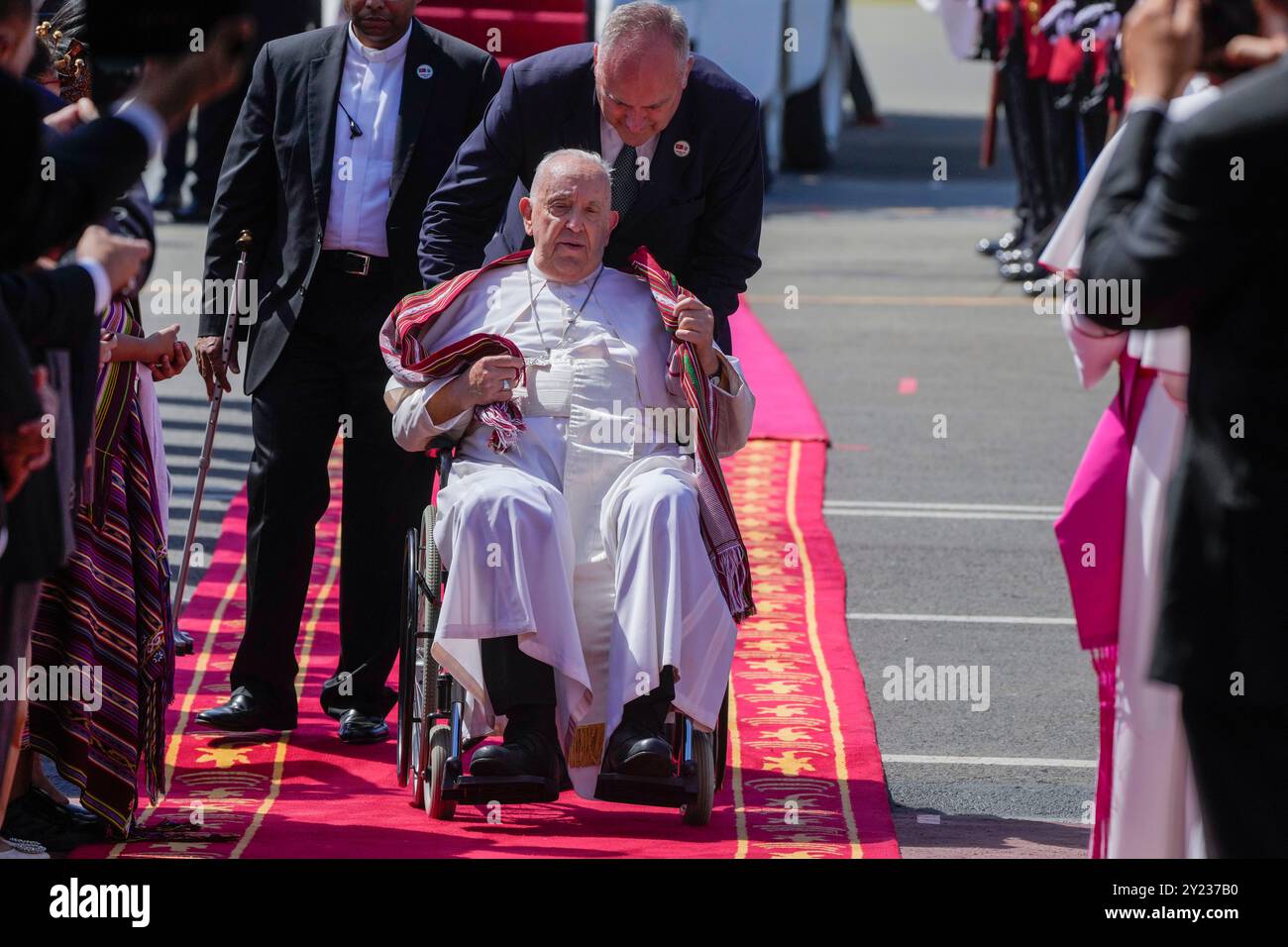 Pope Francis wears a Tais, East Timor's traditional scarf, he was ...