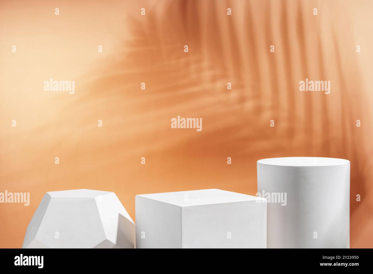 White geometric shapes arranged stylishly on a soft peach background in ...