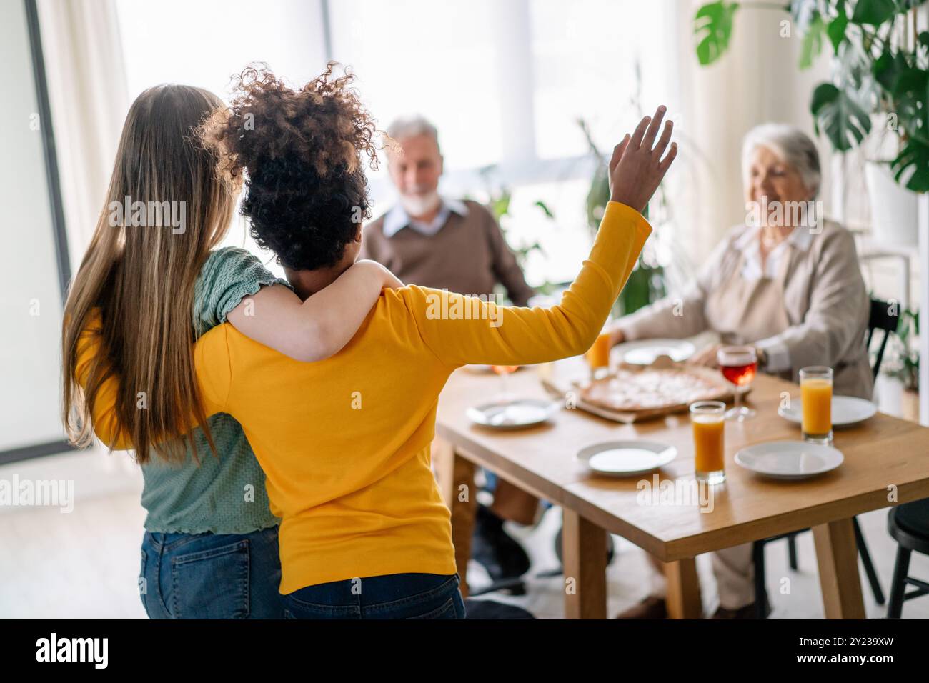 Multiethnic, three generation family together celebration with parents ...