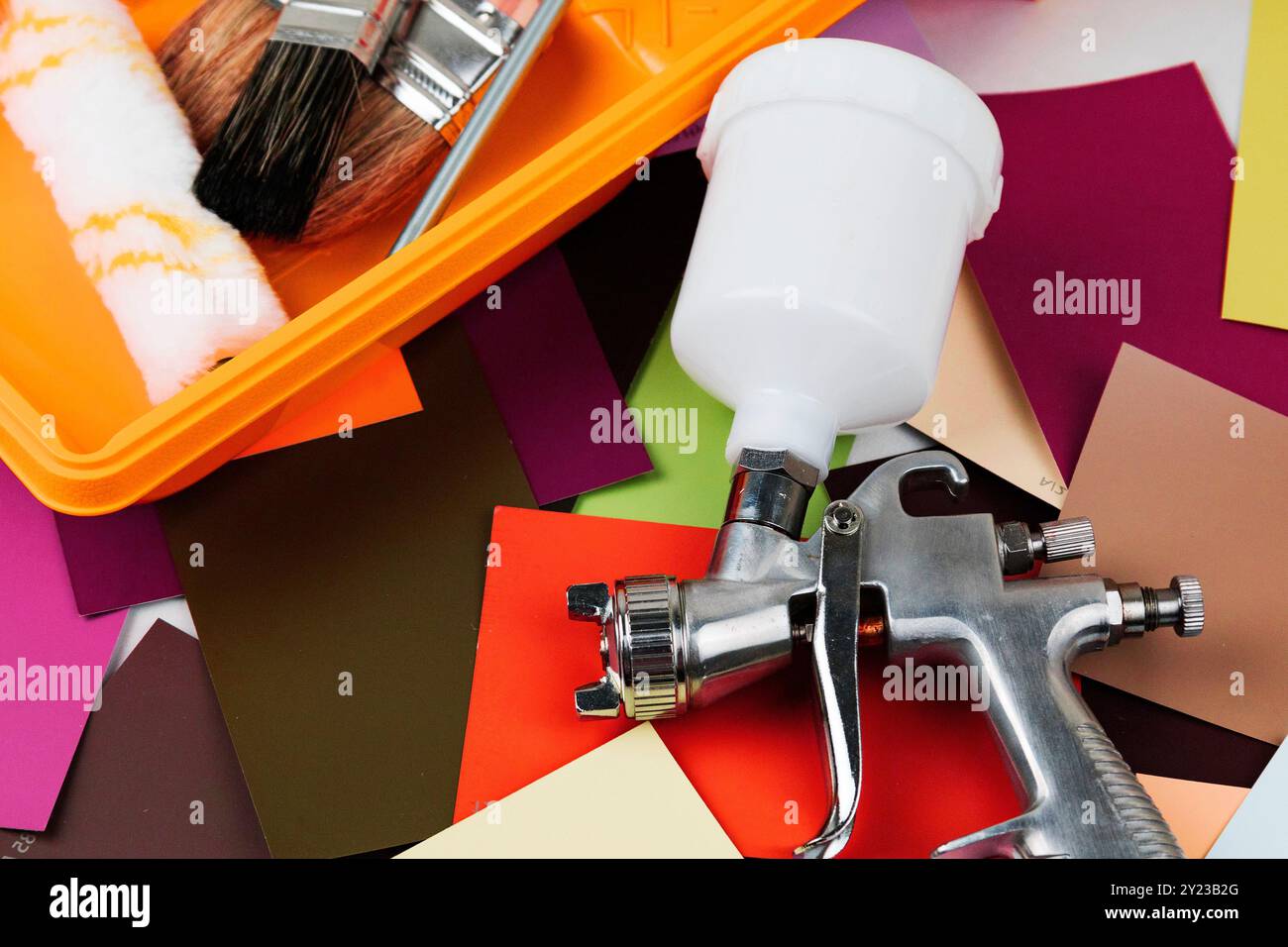 Paint spray gun at work at the workplace in the workshop. Paint Brush ...