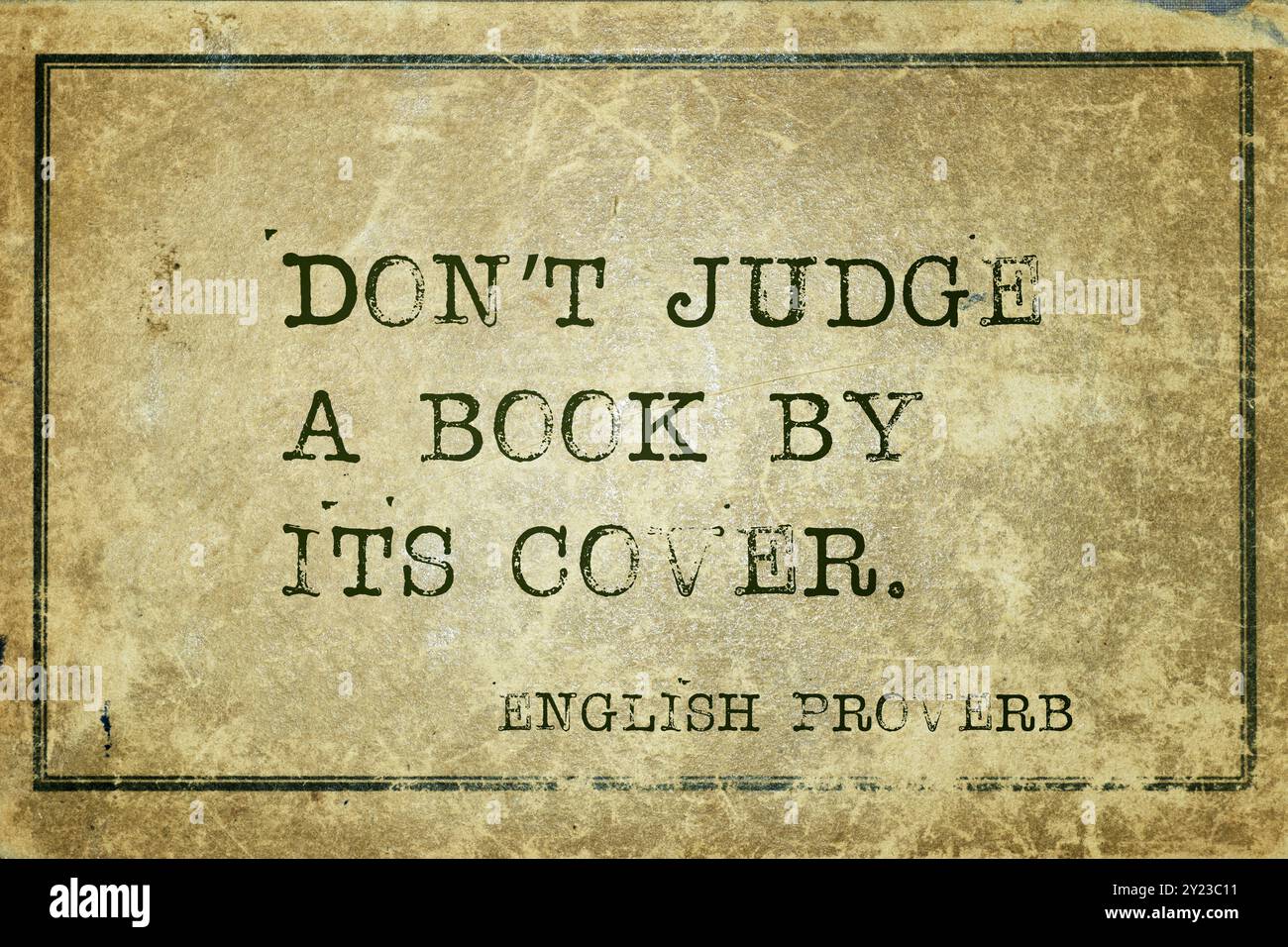 Don’t judge a book by its cover - ancient English proverb printed on grunge vintage cardboard ...