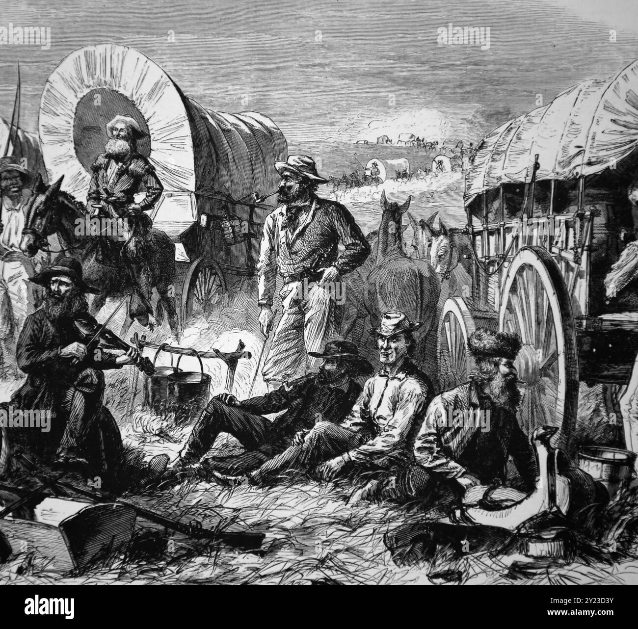 US. Far West. Group un guides and wagon drivers settled around campfire ...