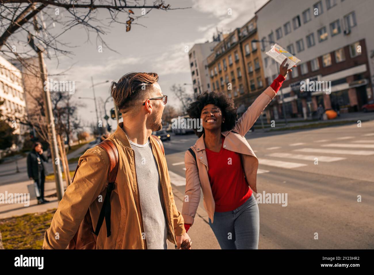 Smiling couple enjoying on vacation, young tourist having fun walking ...