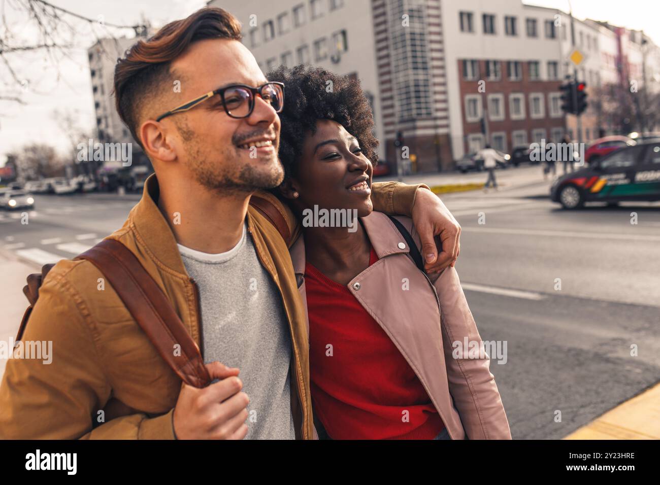 Smiling couple enjoying on vacation, young tourist having fun walking ...