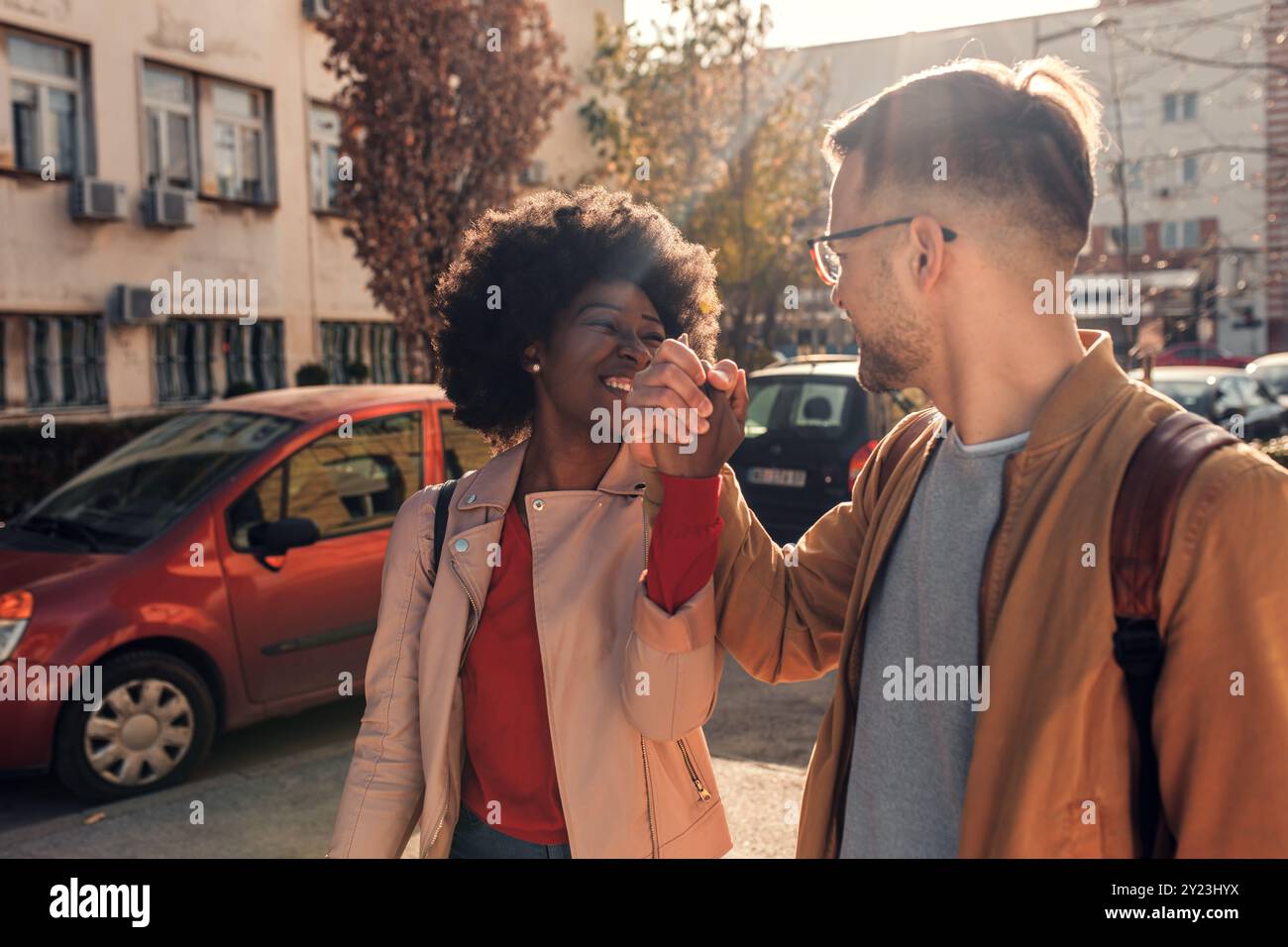 Smiling couple enjoying on vacation, young tourist having fun walking ...