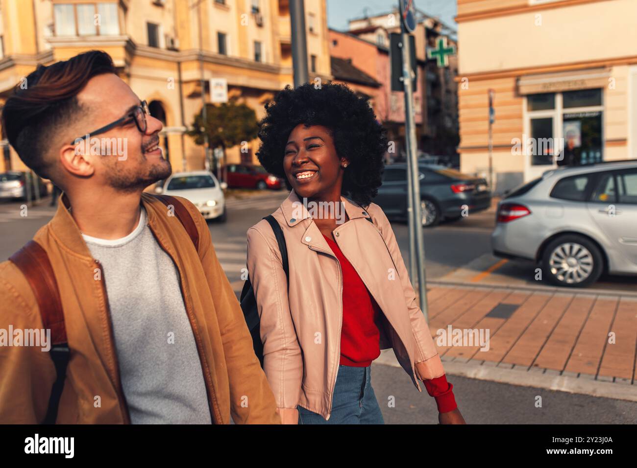 Smiling couple enjoying on vacation, young tourist having fun walking ...