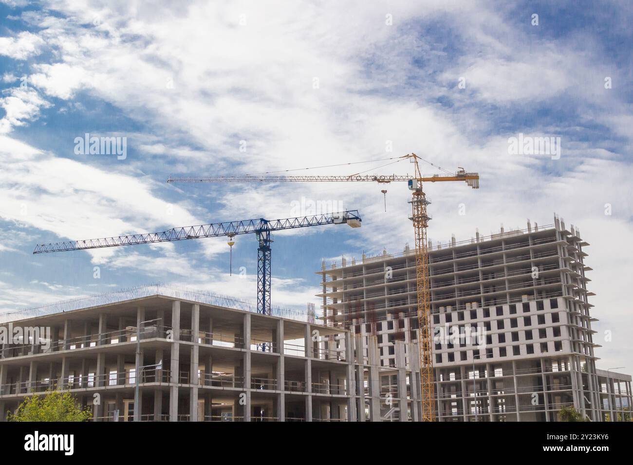 Construction of two buildings. Building frames made of concrete slabs ...