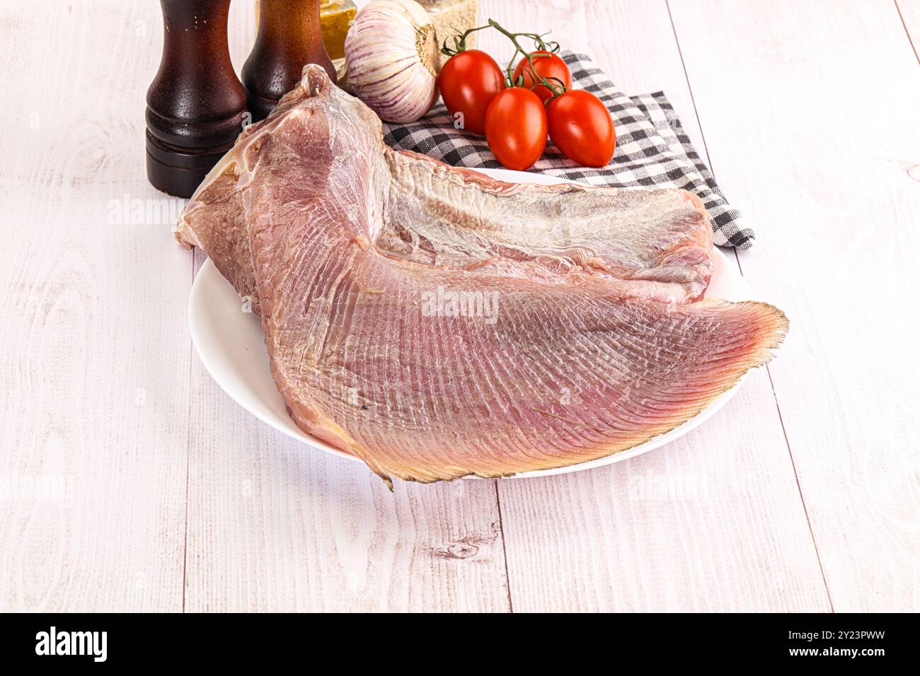 Raw uncooked stingray fish wing in thw plate Stock Photo - Alamy
