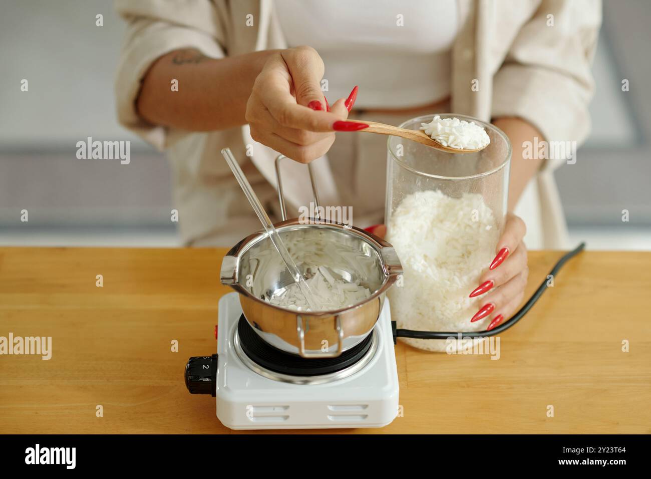 Woman Melting Wax For Candles Stock Photo - Alamy