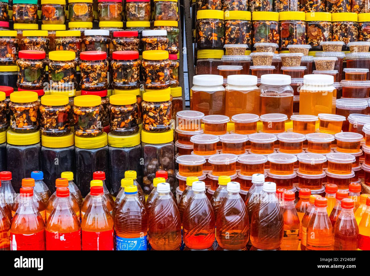 Bottles with honey and tea on a Market stall in Bishkek the capital in ...