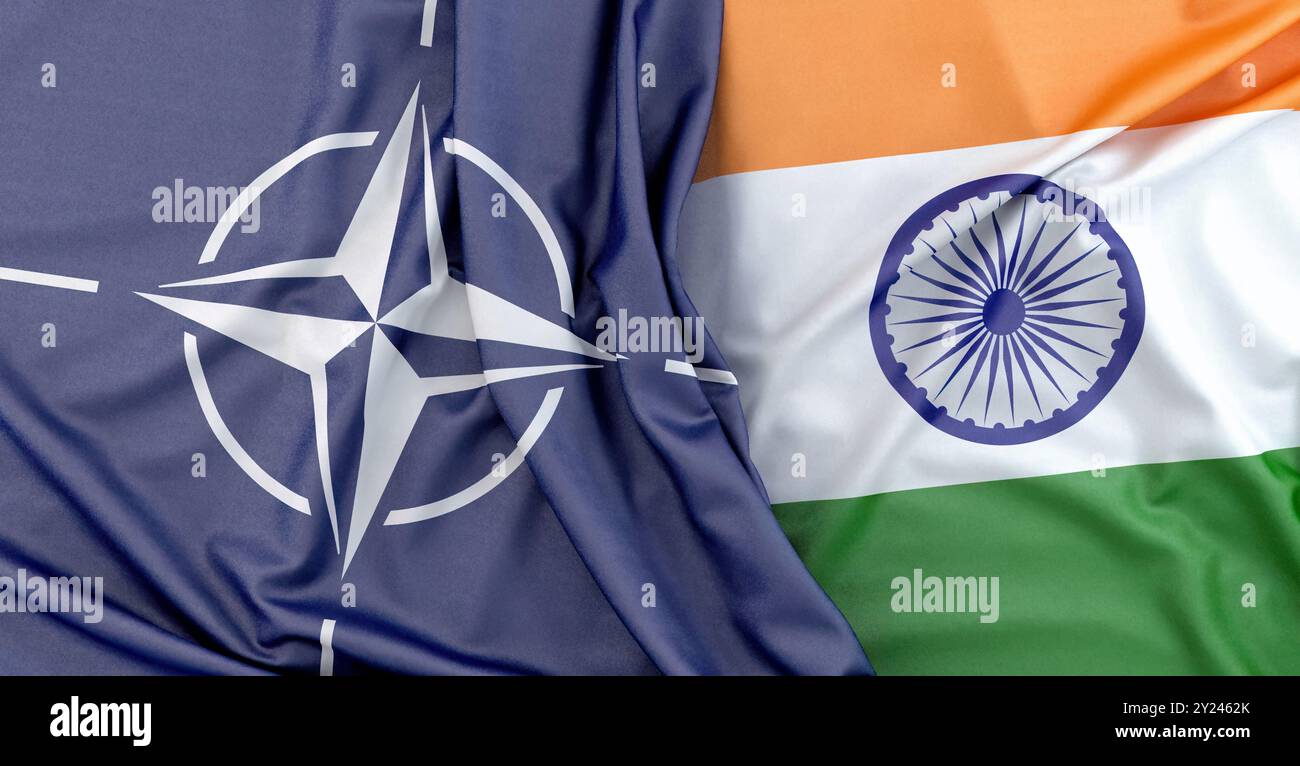 Flags of India and NATO laying together symbolizing political ...