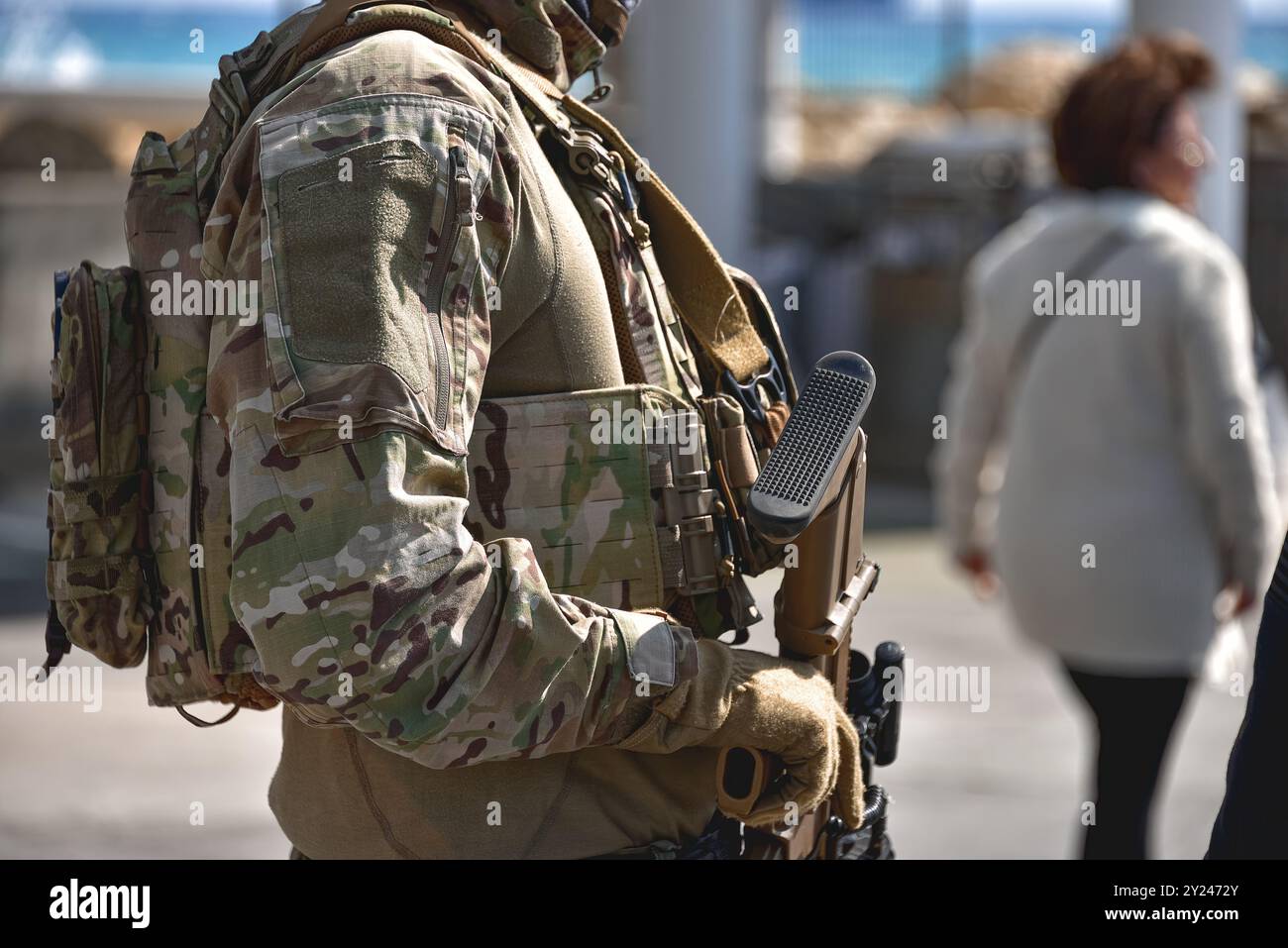 Soldier wearing camouflage uniform standing guard protecting city ...