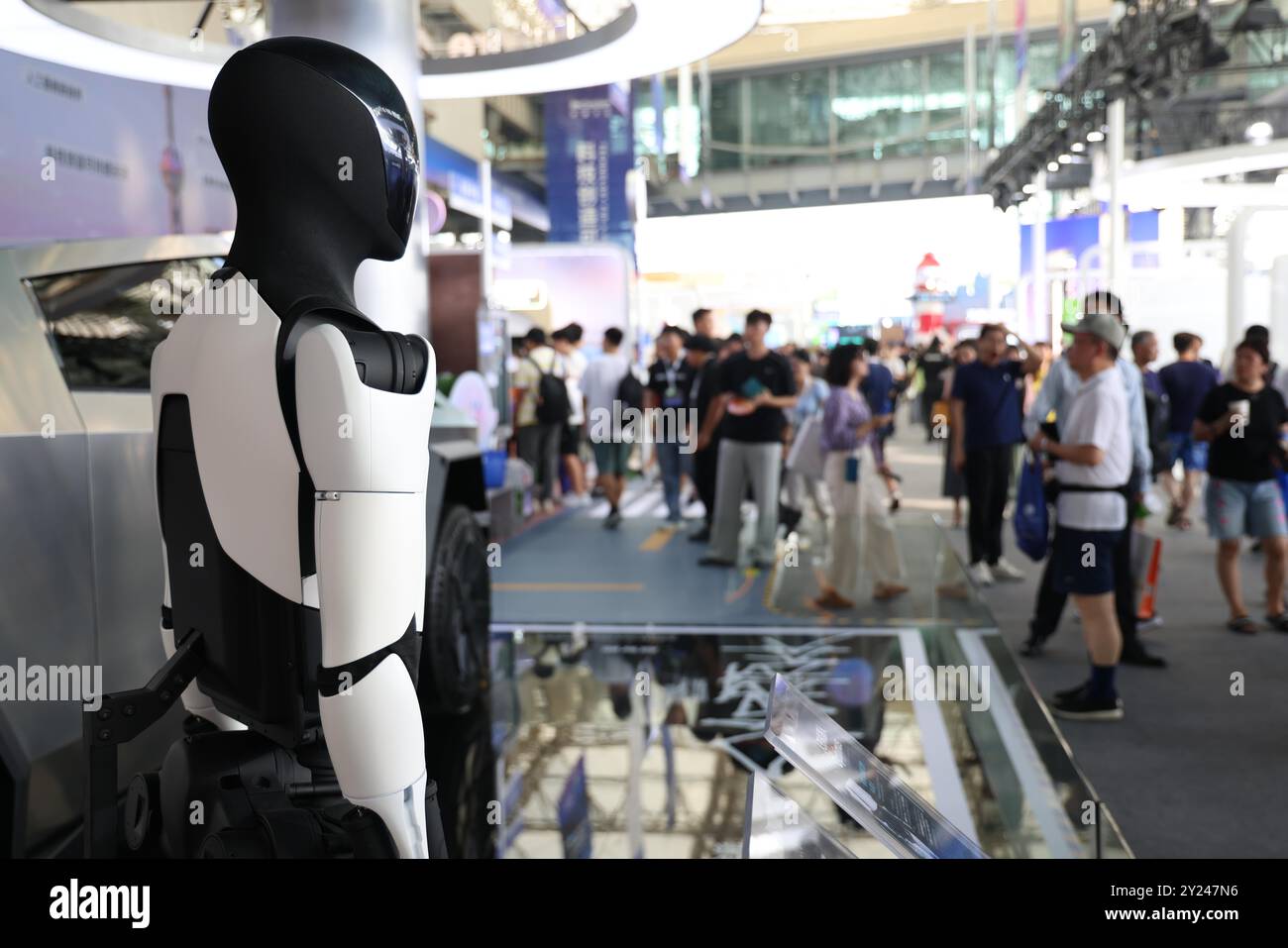 Tesla's latest humanoid robot Optimus makes debut at the 2024 Inclusion ...