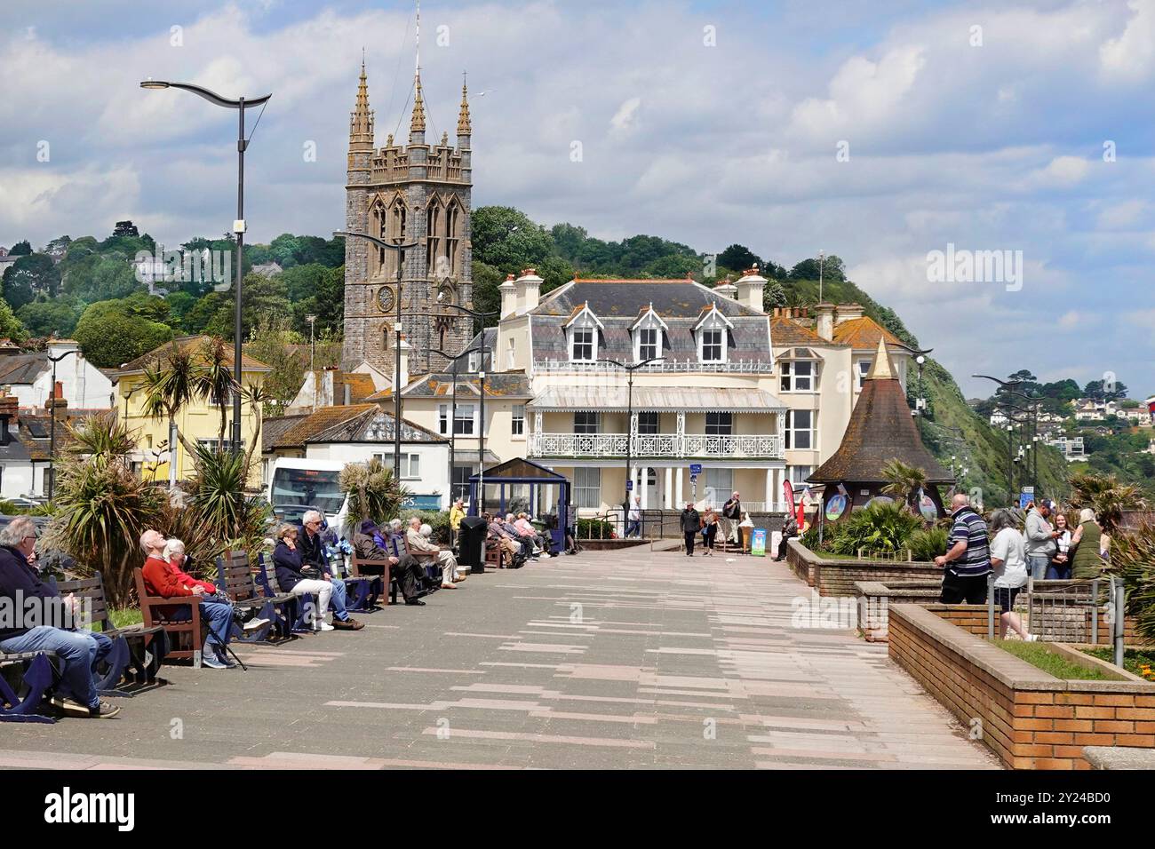 Teignmouth seaside resort wide promenade long row of seats very popular for senior mature & old ...