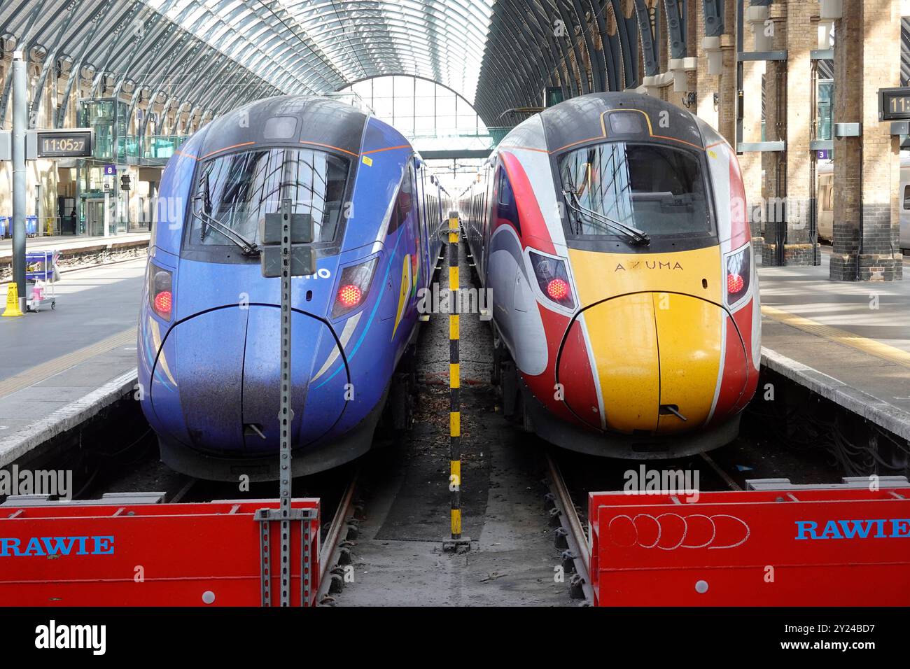 Train driver cabs at one end of Red & yellow LNER Azuma train beside ...