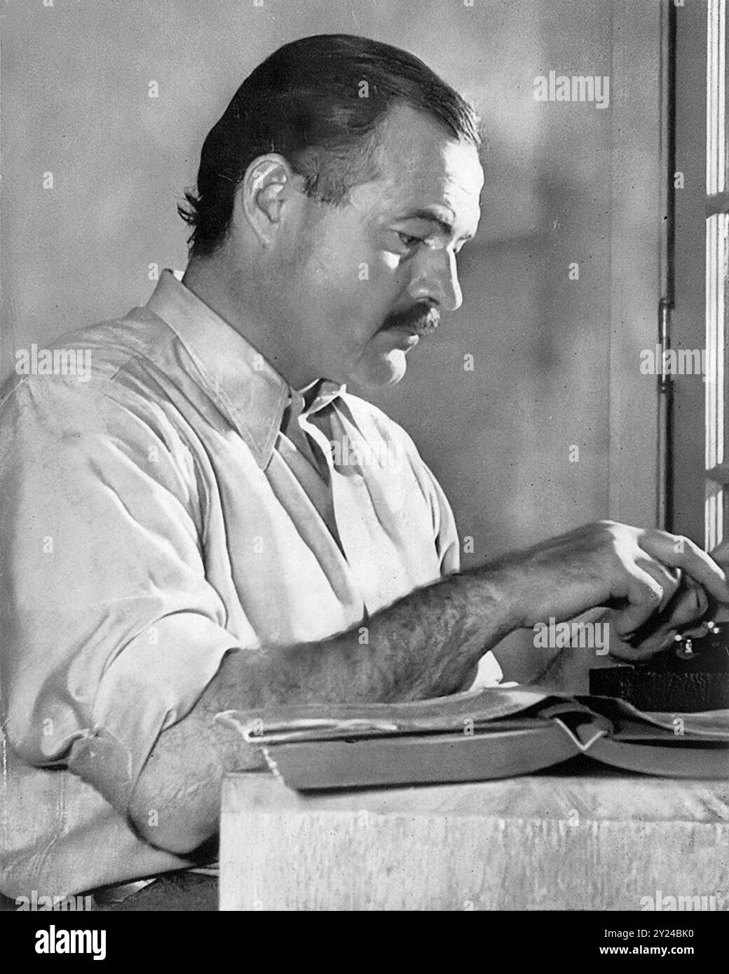 Hemingway posing for a dust jacket photo by Lloyd Arnold for the first ...