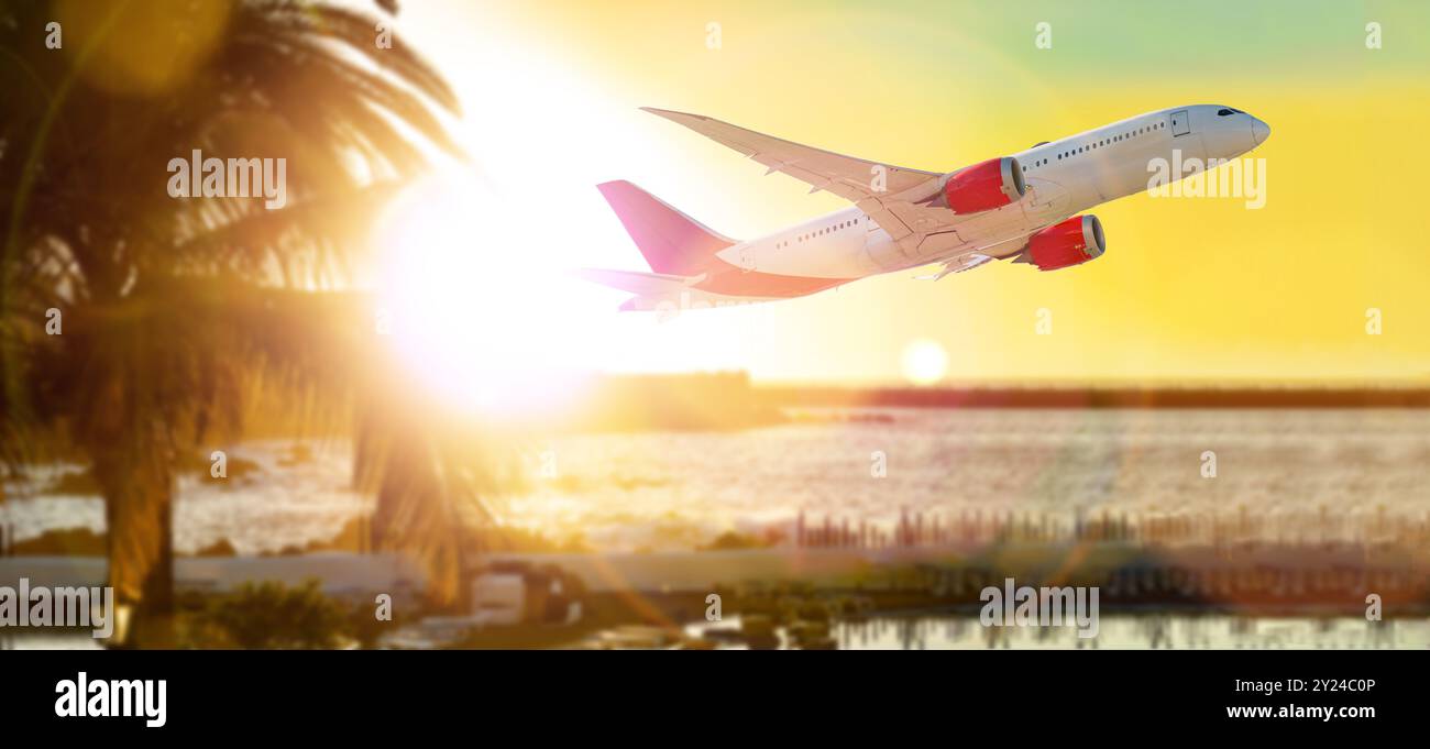 Airplane flying over amazing ocean scenery with tropical island. Beach ...