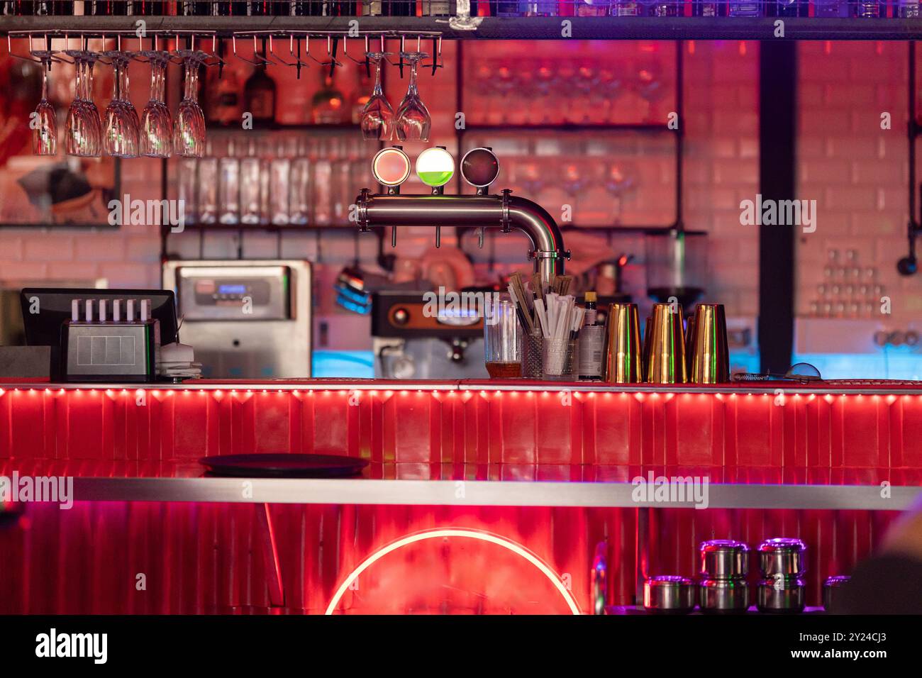 Empty bar counter with beer taps illuminated at night Stock Photo - Alamy