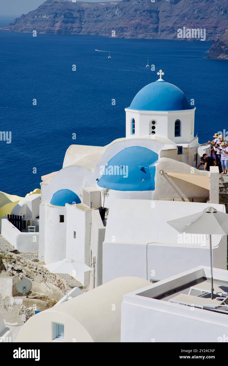 Blue Domes of Santorini Greece with whitewashed building and a view of ...