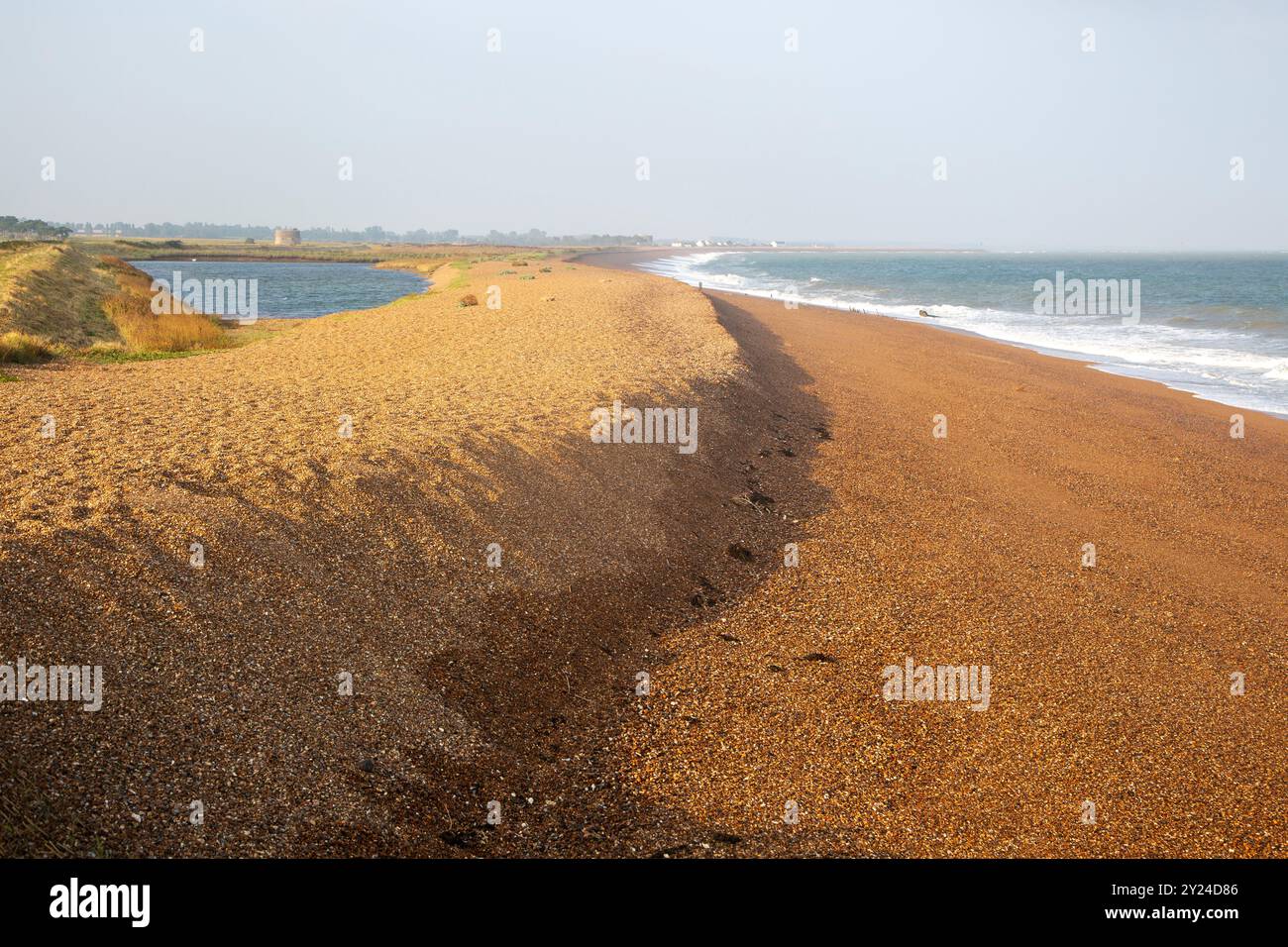 North Sea coastline view of shingle ridge and lagoon on beach bar ...