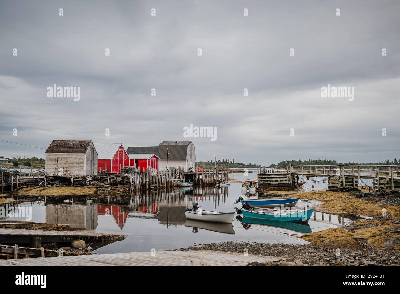 coastal inlet with fishing shacks and dories Stock Photo - Alamy