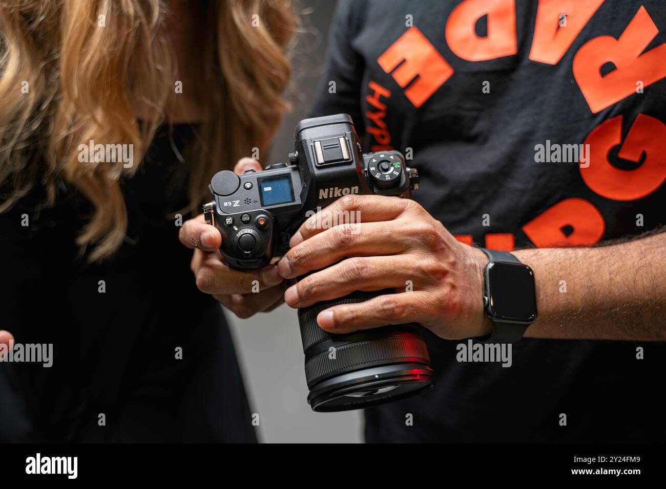 Men holding Nikon Z6 iii camera in hand. selective focus Stock Photo ...