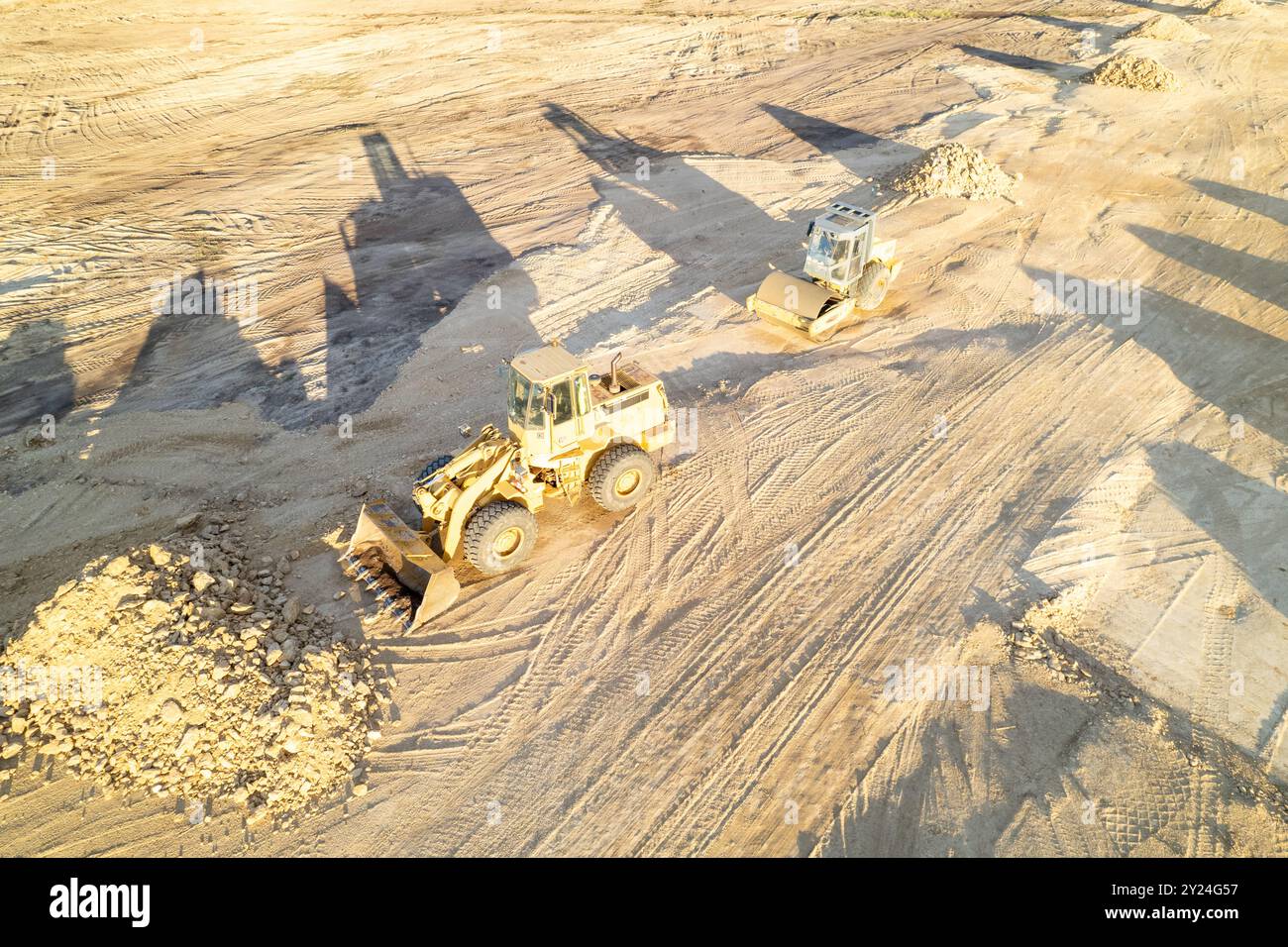 earthmoving machines on a construction site, aerial view with drone ...