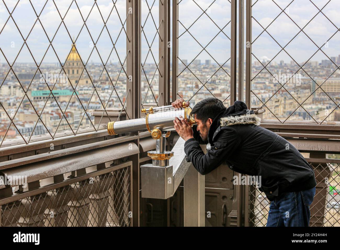 Asian tourist using spotting scope on Eiffel Tower to watch panoramic ...