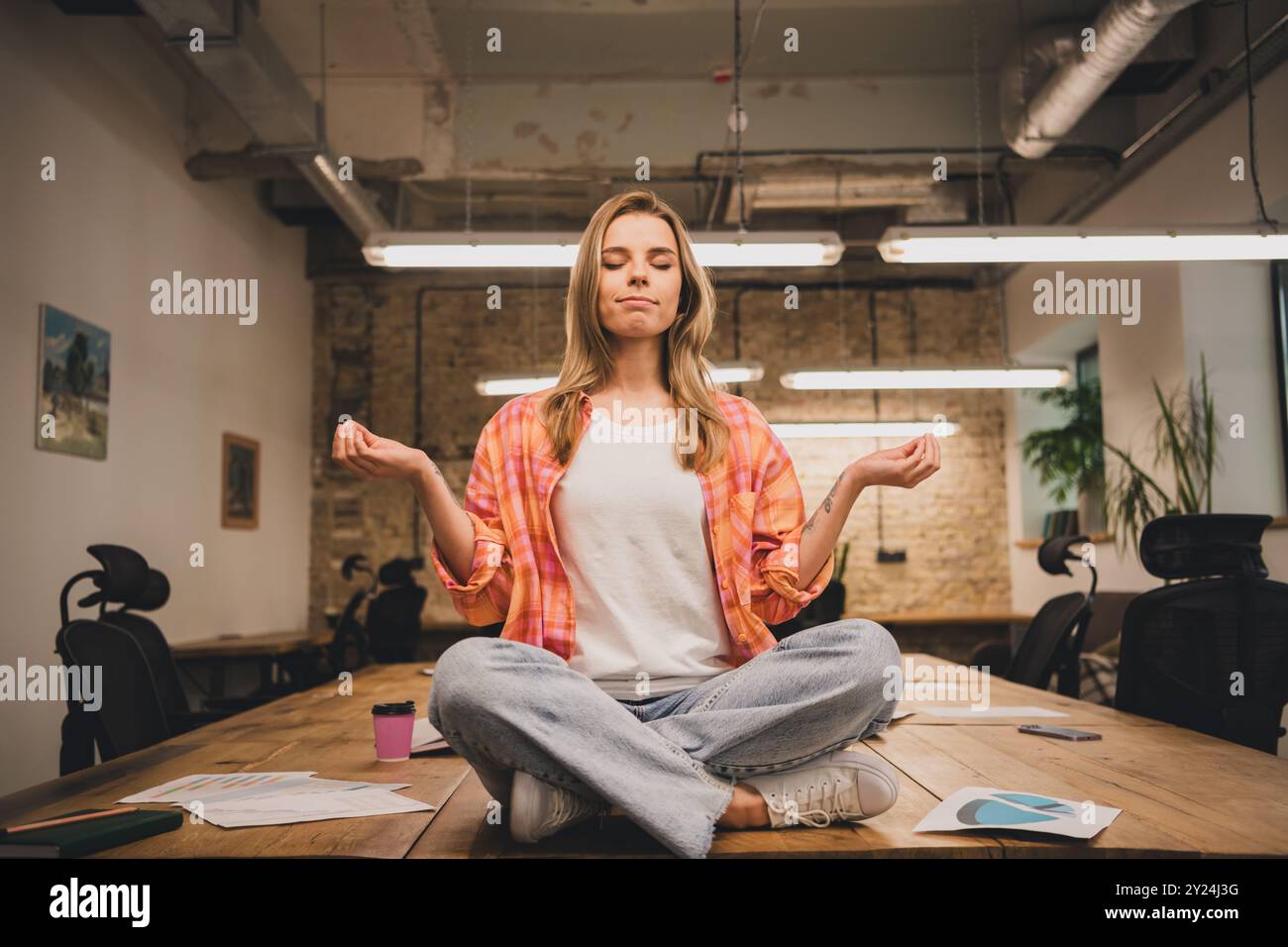 Full body photo of young office worker woman meditate desk loft ...