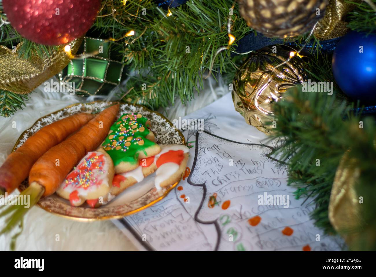 Cookies, carrots and letter left for Santa under a Christmas tree Stock ...