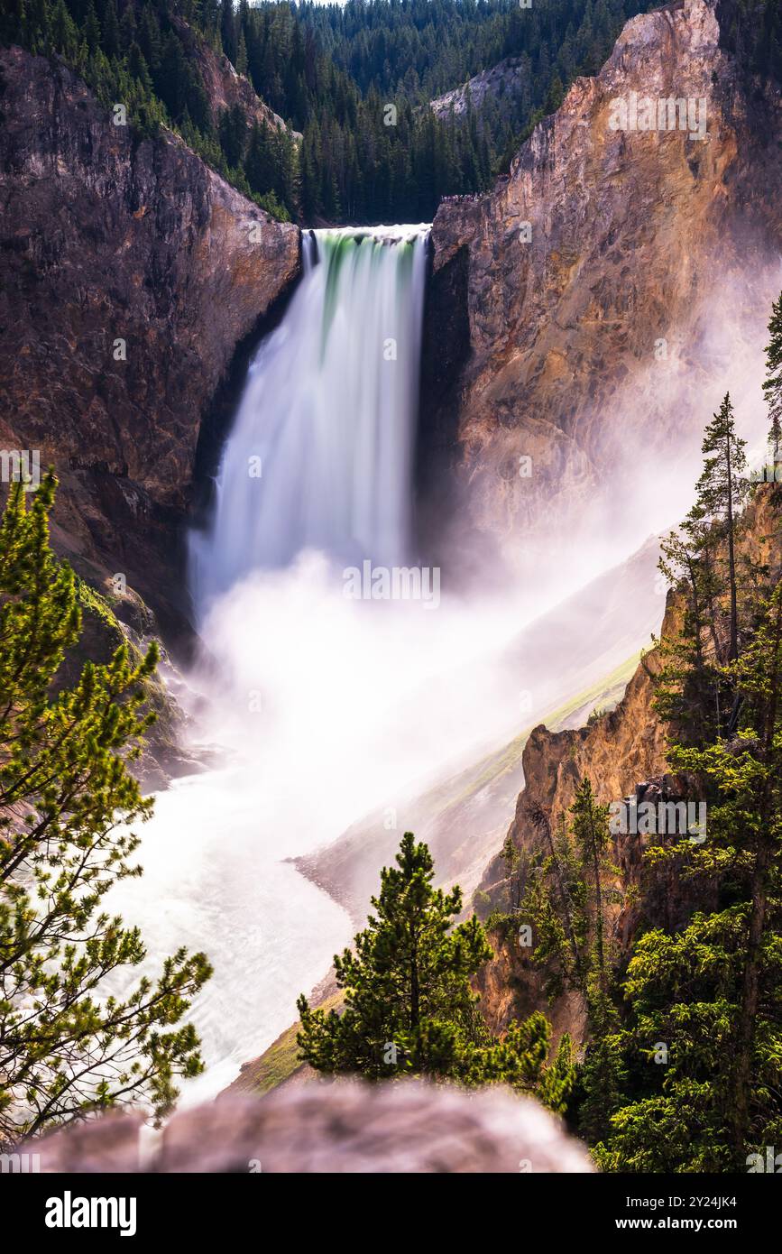 Upper Falls in Yellowstone plunging dramatically down rugged cliffs ...