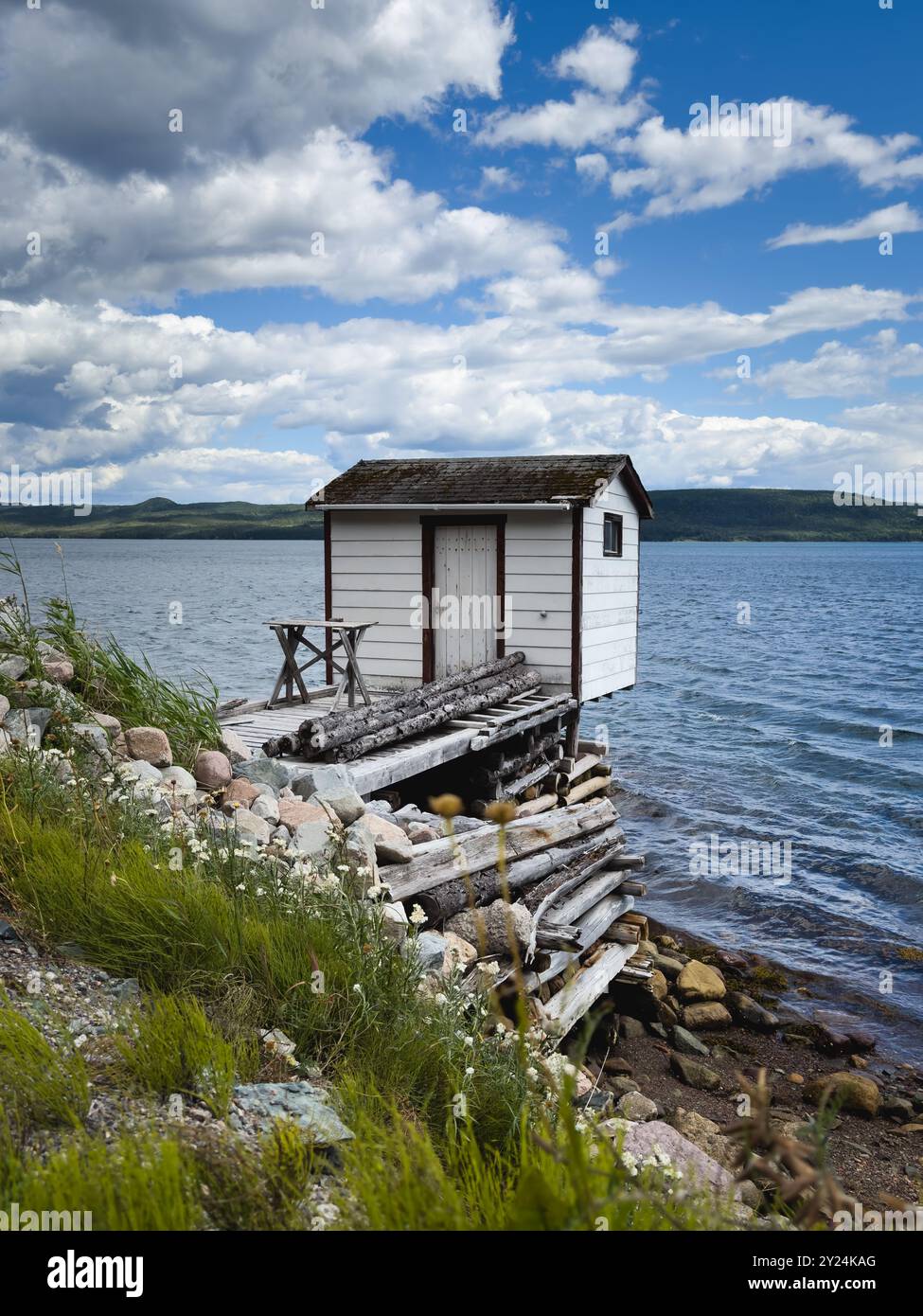 White fishing stage building at edge of ocean in Newfoundland Stock ...