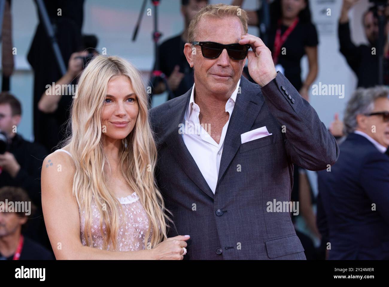 Sienna Miller and Kevin Costner attend the Closing Ceremony red carpet ...