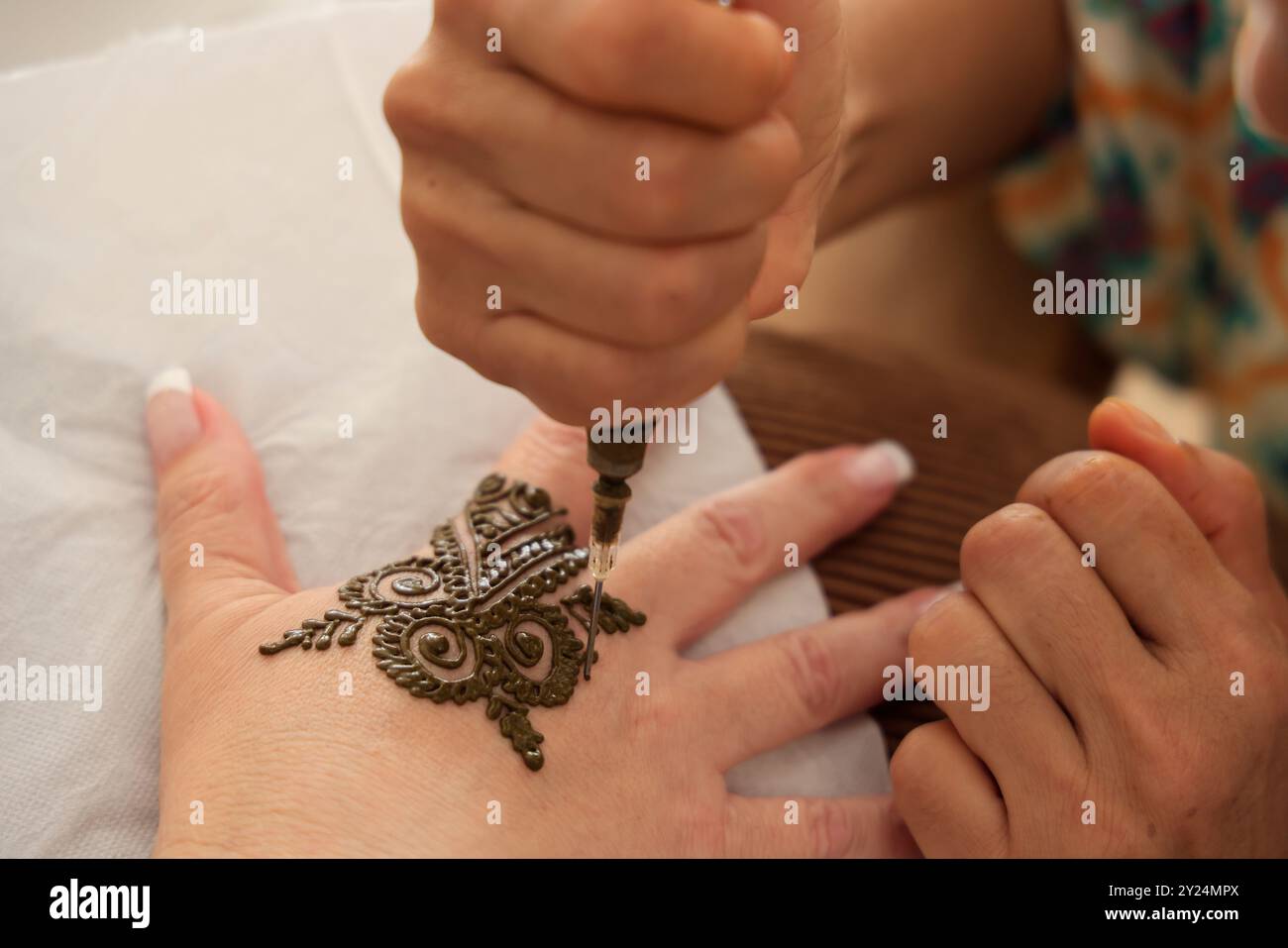 Temporary tattoo of woman's hands with henna in the Marrakech region of ...