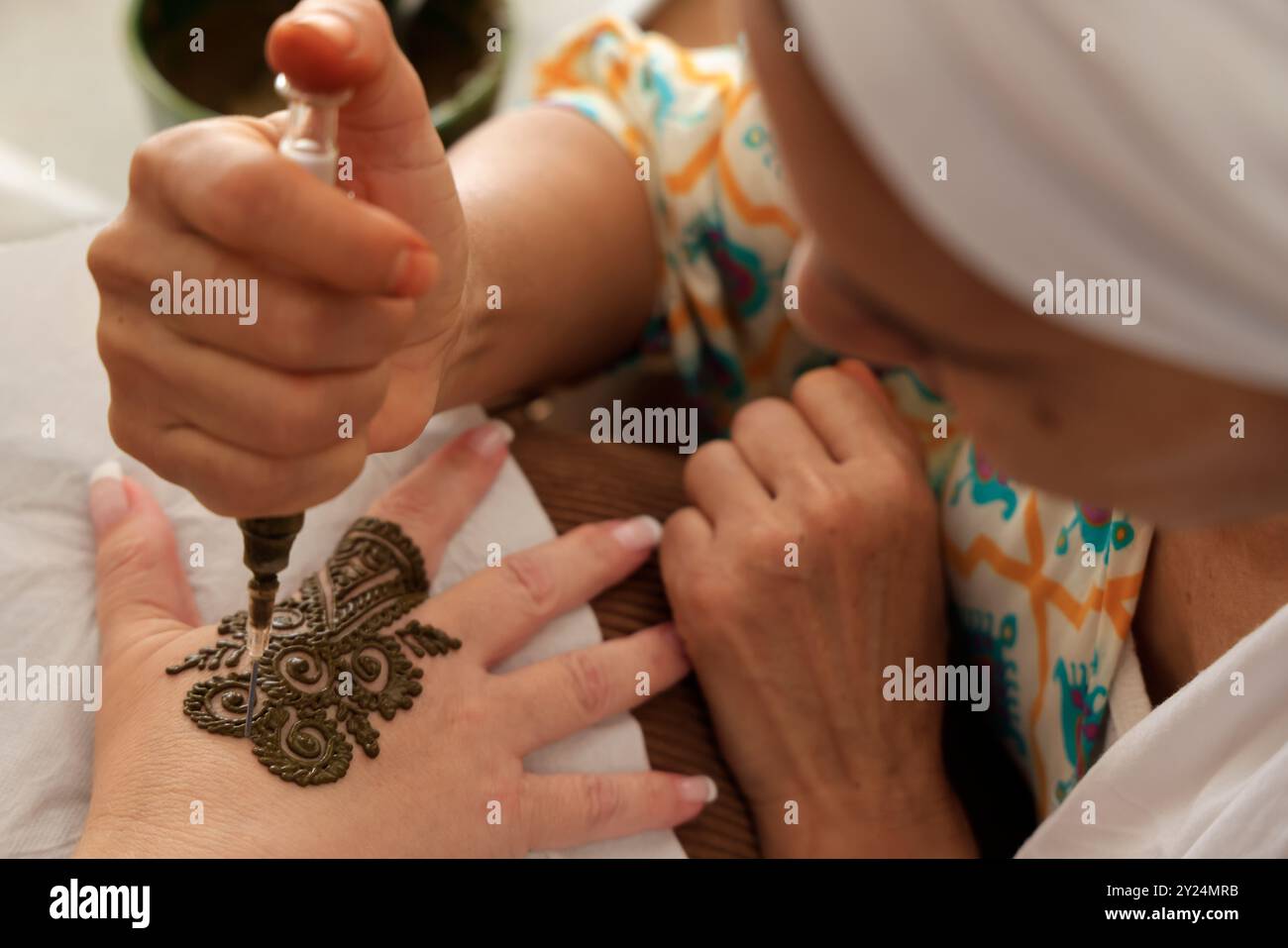 Temporary tattoo of woman's hands with henna in the Marrakech region of ...