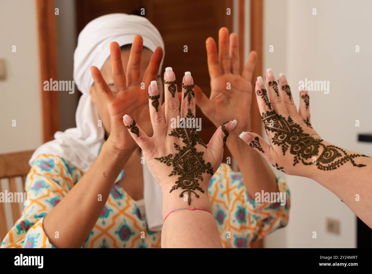 Temporary tattoo of woman's hands with henna in the Marrakech region of ...