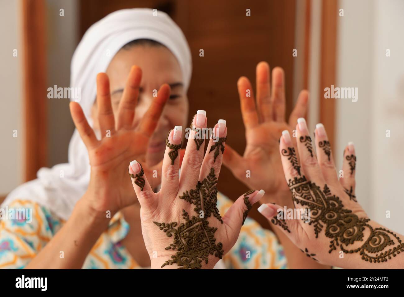 Temporary tattoo of woman's hands with henna in the Marrakech region of ...