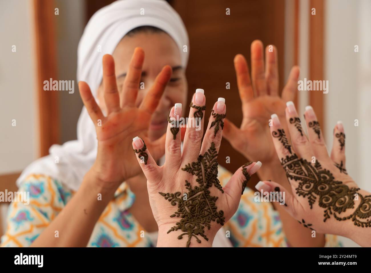 Temporary tattoo of woman's hands with henna in the Marrakech region of ...