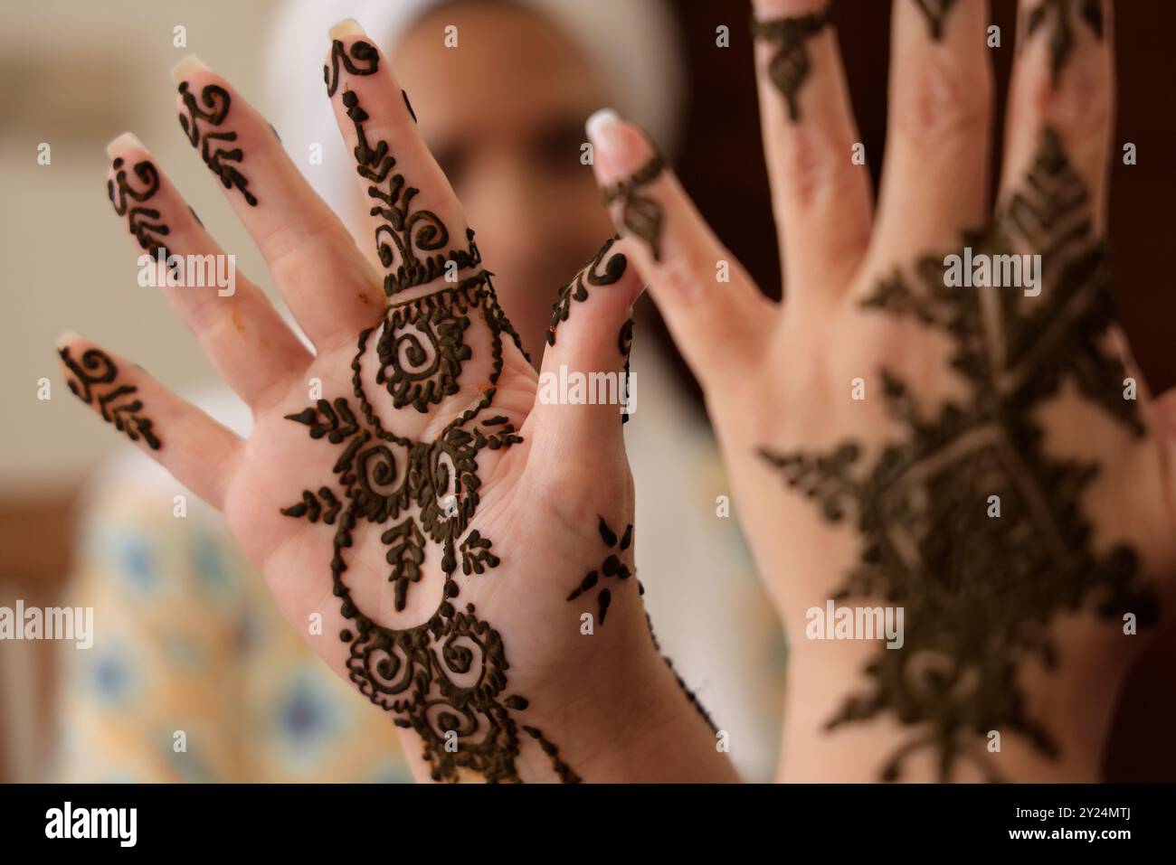 Temporary tattoo of woman's hands with henna in the Marrakech region of ...