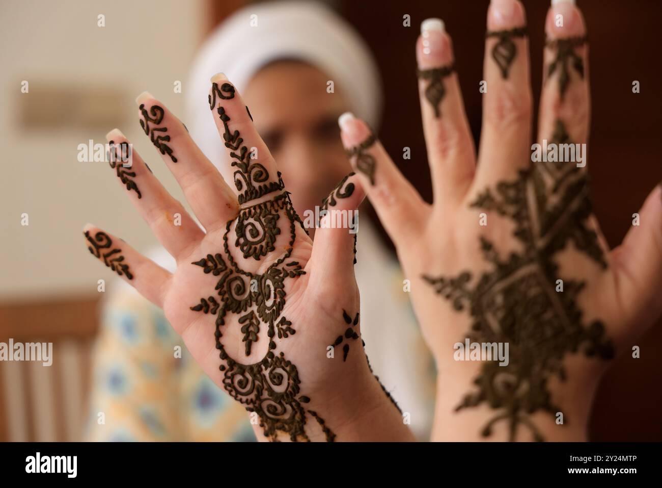 Temporary tattoo of woman's hands with henna in the Marrakech region of ...