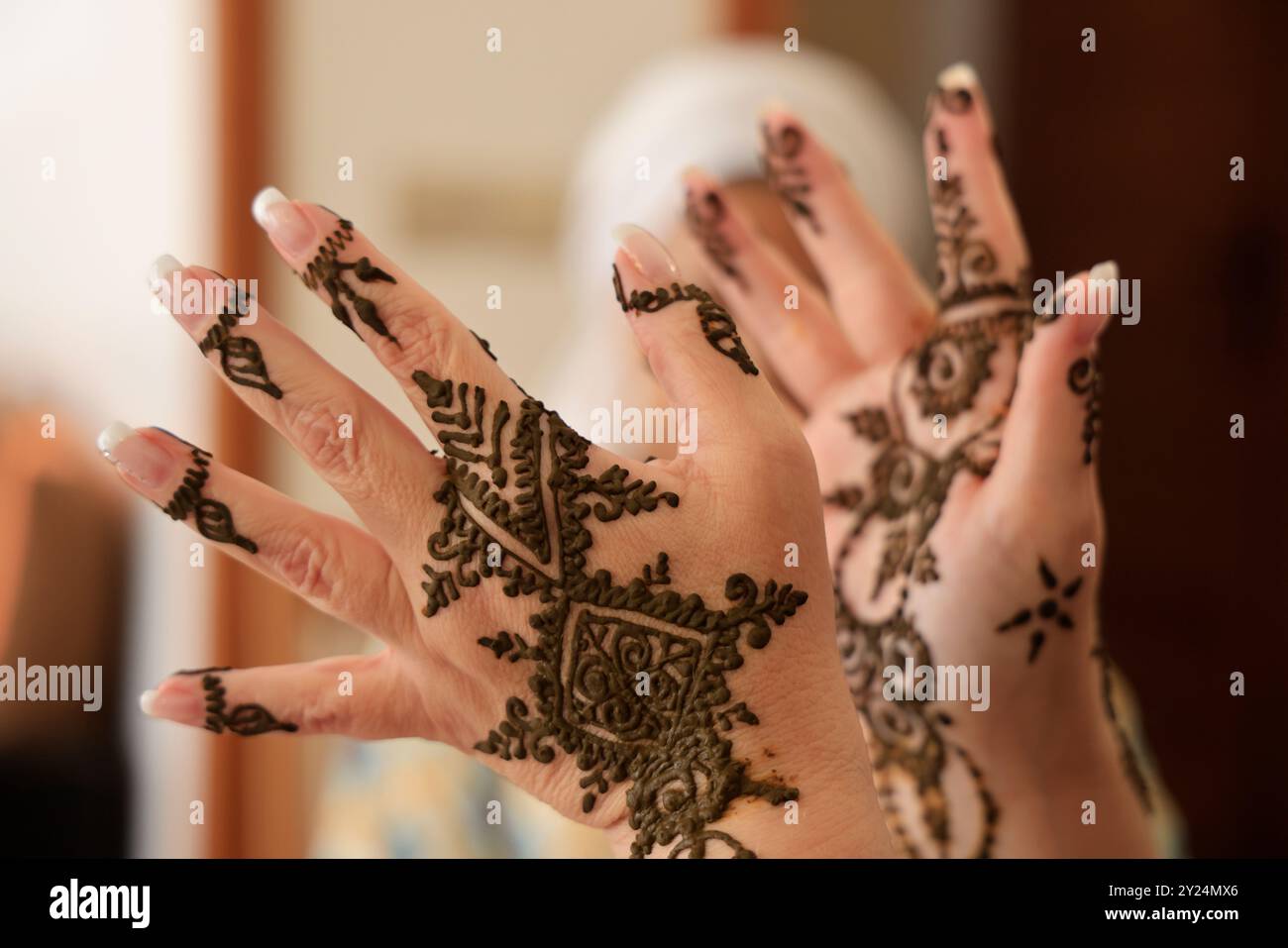 Temporary tattoo of woman's hands with henna in the Marrakech region of ...