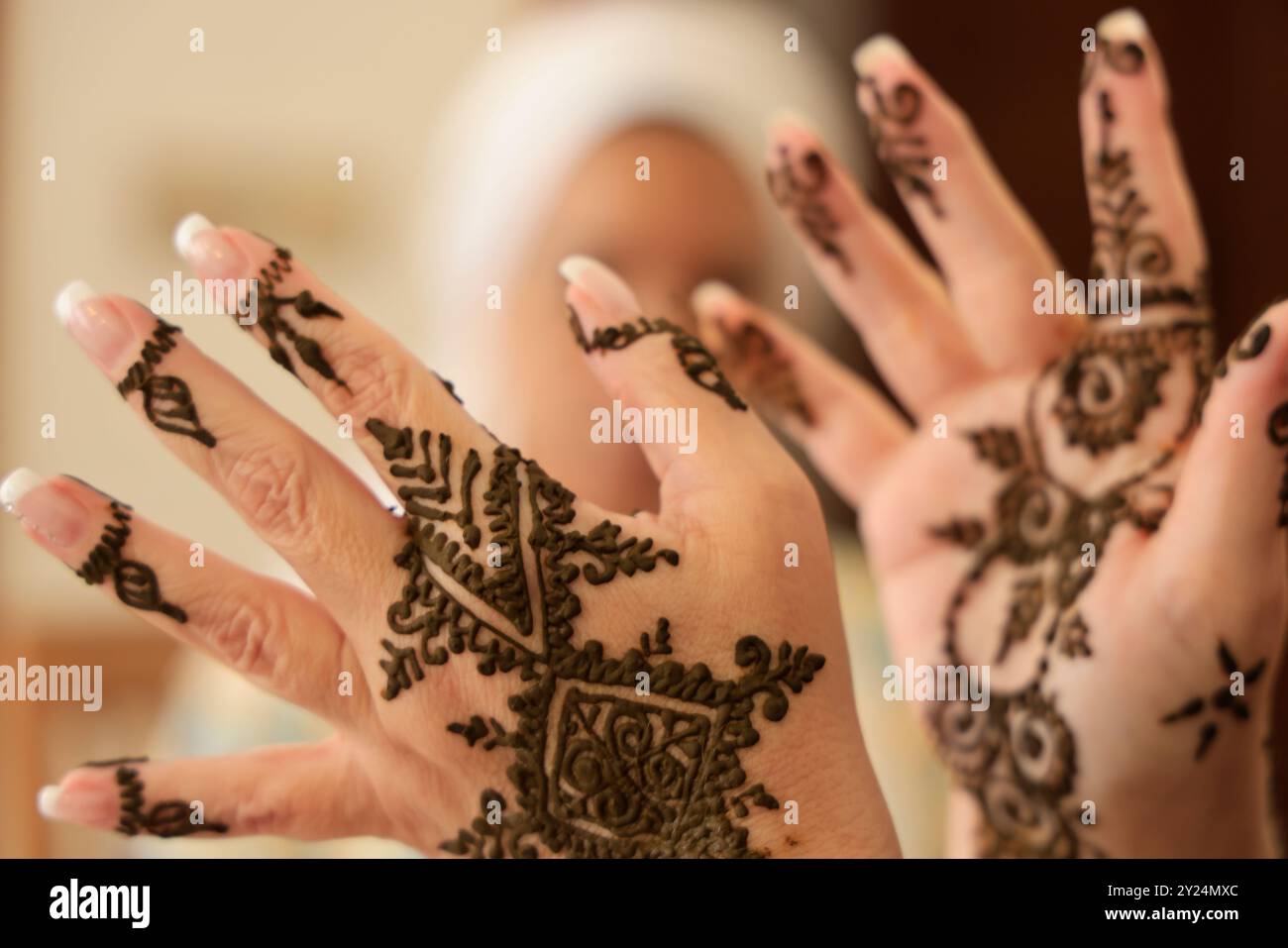 Temporary tattoo of woman's hands with henna in the Marrakech region of ...