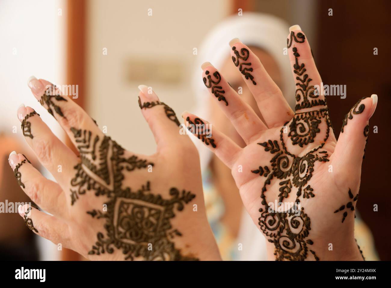 Temporary tattoo of woman's hands with henna in the Marrakech region of ...