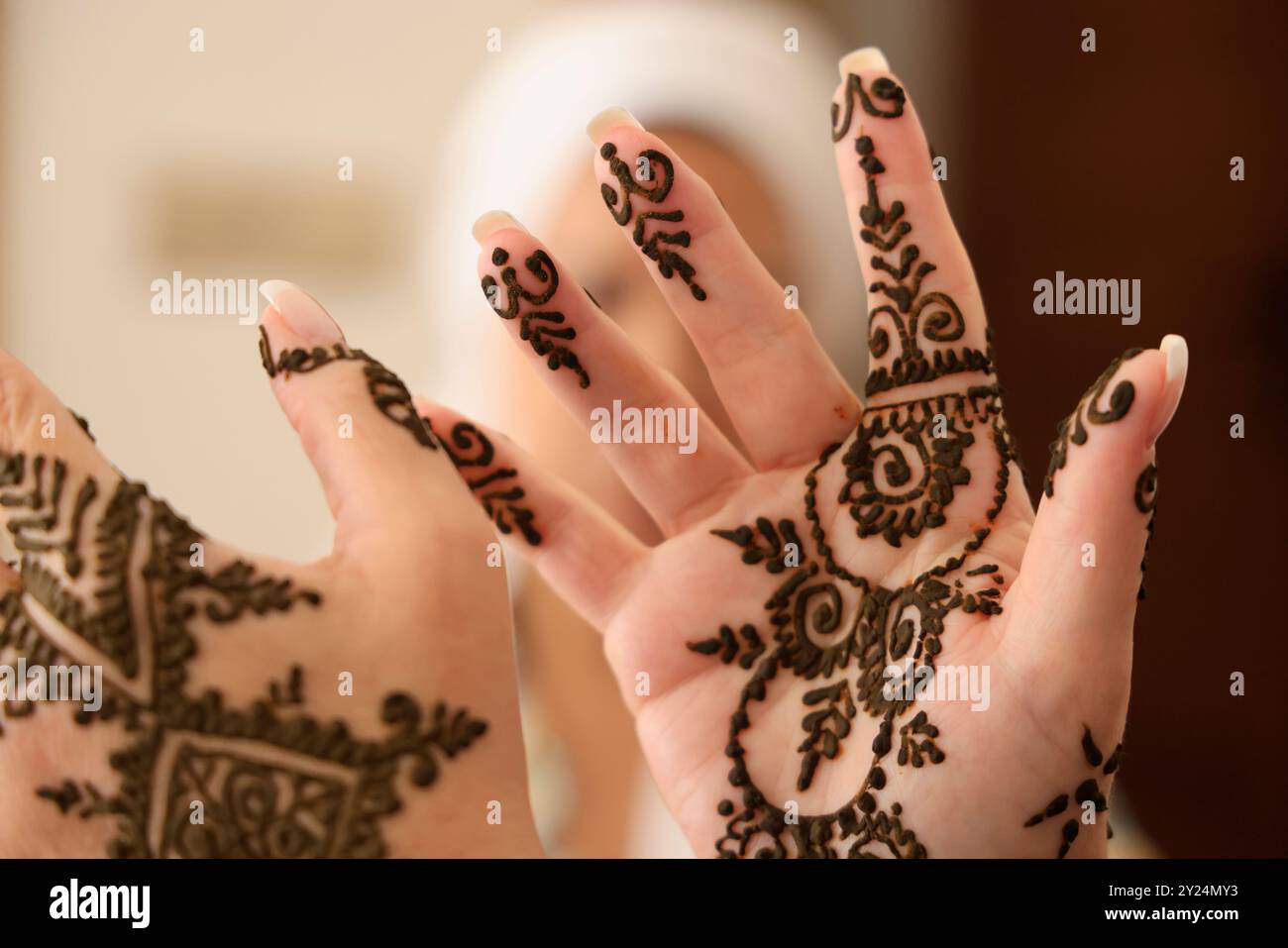 Temporary tattoo of woman's hands with henna in the Marrakech region of ...