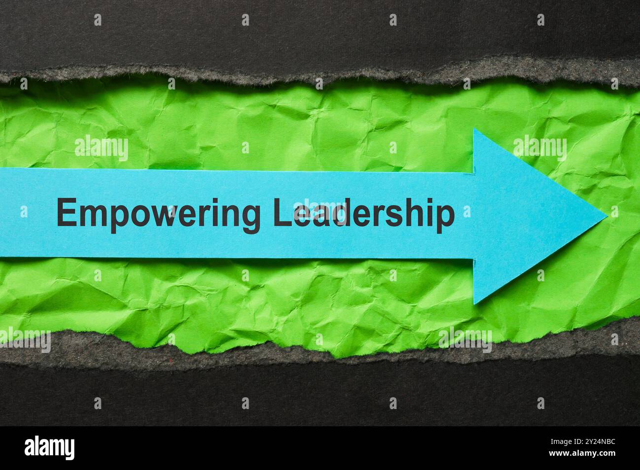 Paper arrow with the label empowering leadership Stock Photo - Alamy