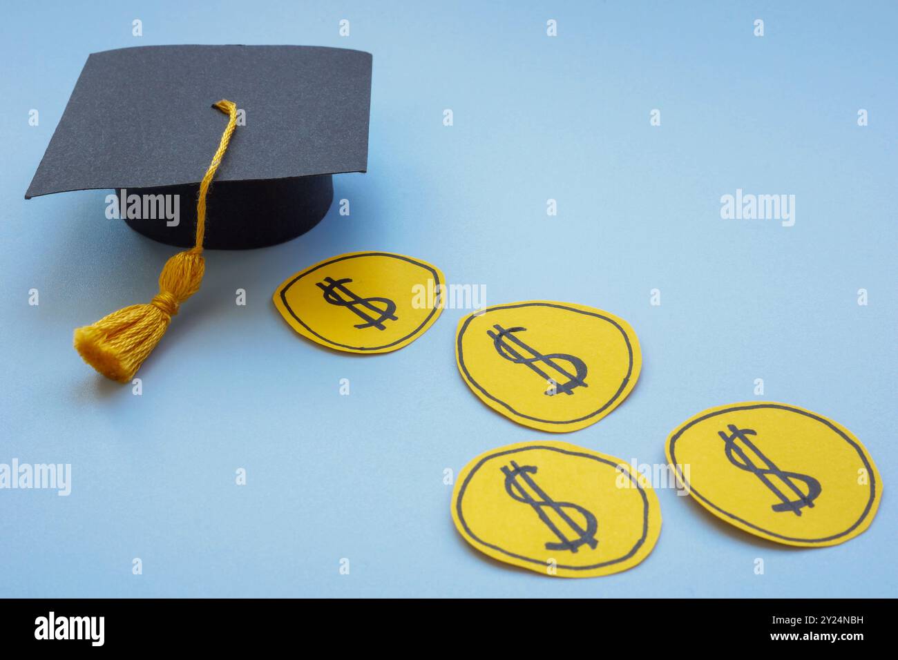 Graduation cap and dollar signs as symbol of education investment Stock ...
