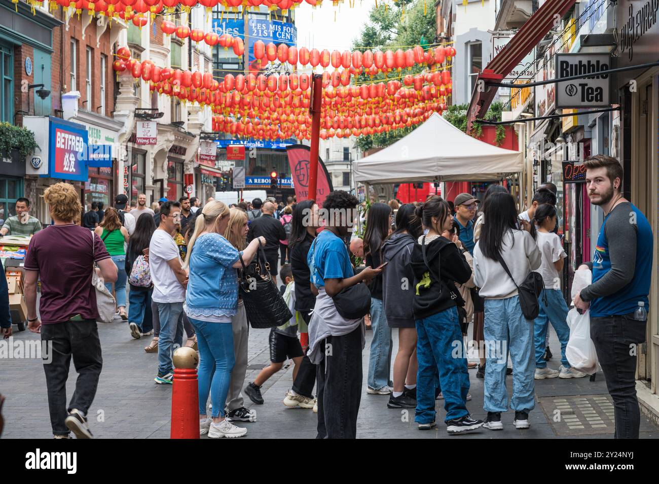 Street scene with people queueing outside bubble tea shop on Wardour ...
