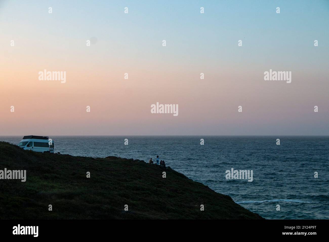 Sunset in a family's camper van on some cliffs by the sea Stock Photo ...