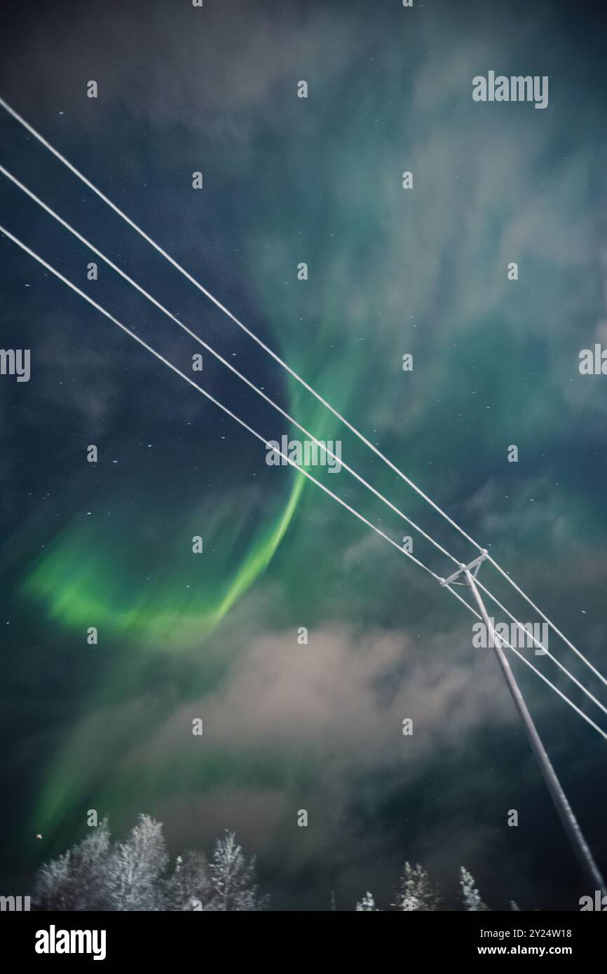 Aurora borealis green explosion above power lines in Rovaniemi, Lapland ...