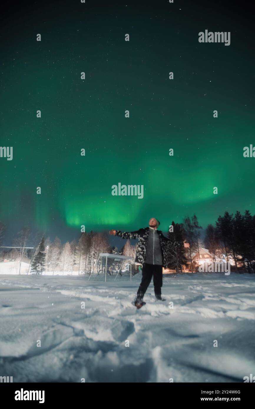Man stood in snowy football pitch under northern lights in Rovaniemi ...